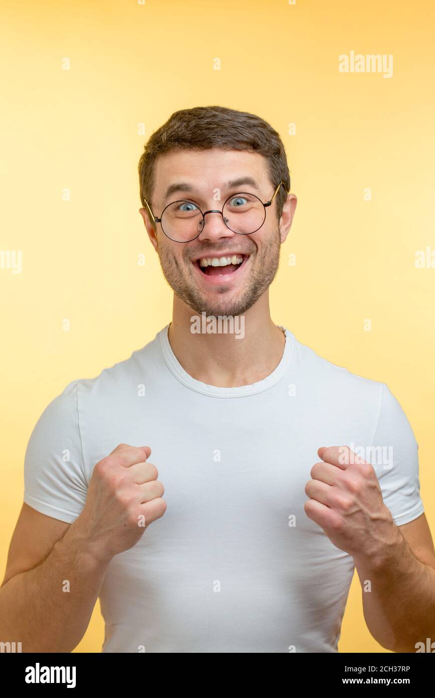 a crazy man with large eyes and clenched fists.have fun. fool guy in ...