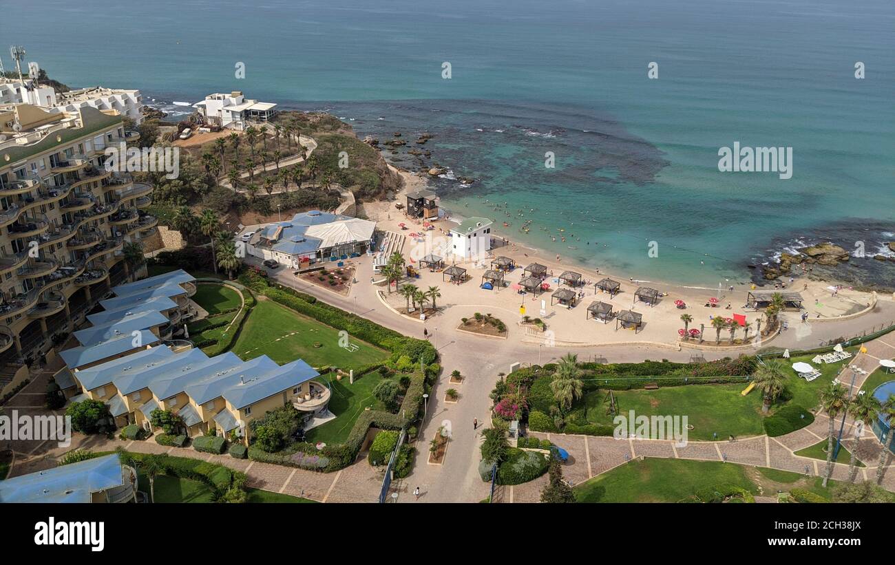 Mediterranean ocean beach landscape with green lawns and houses at Sea ...