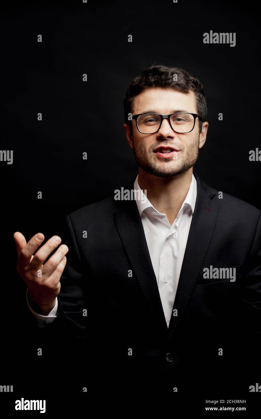 emotional singer in stylish suit. public speaking. oratory concept ...