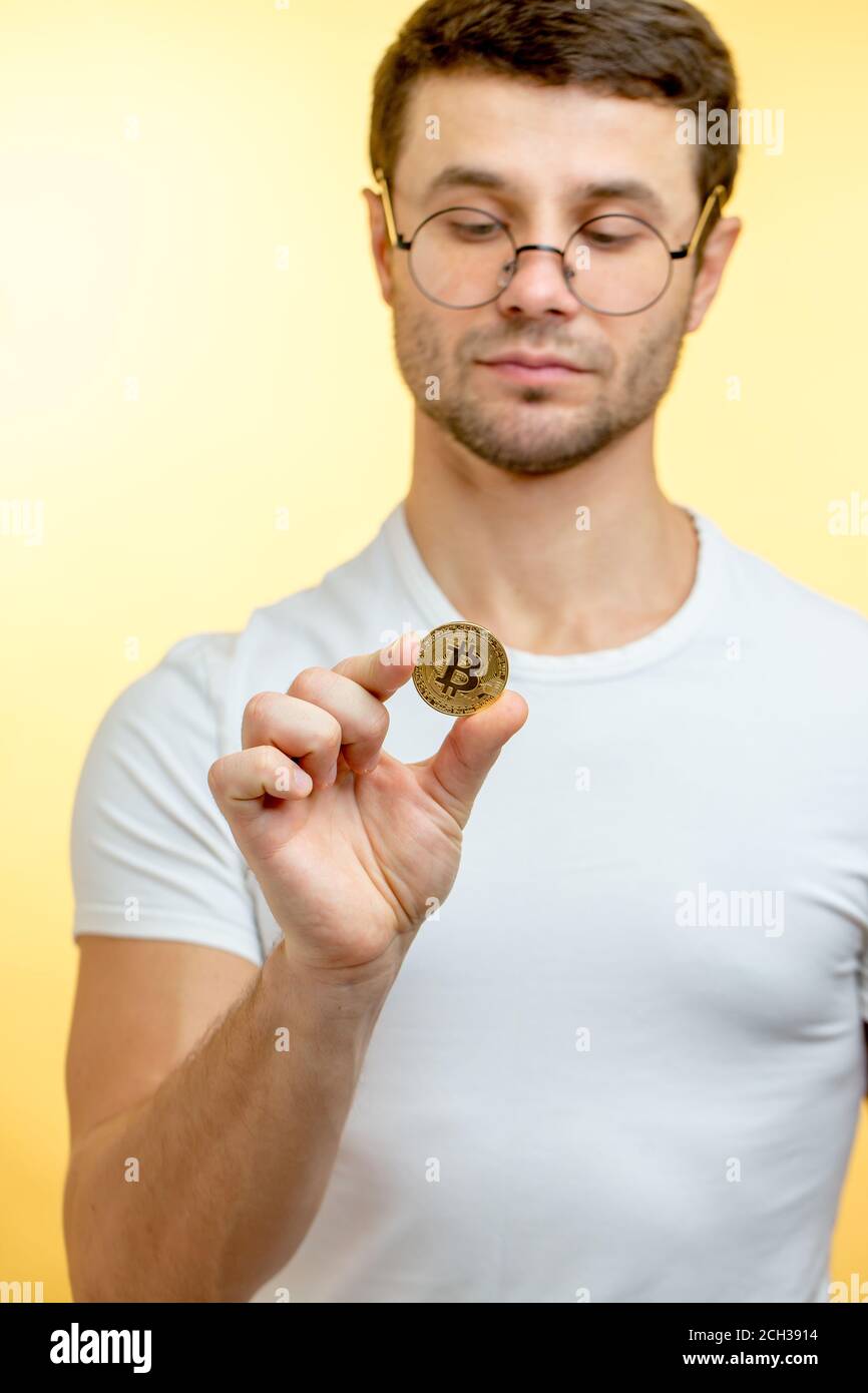 close up portrait. focus on the golden coin. money and hobby concept ...
