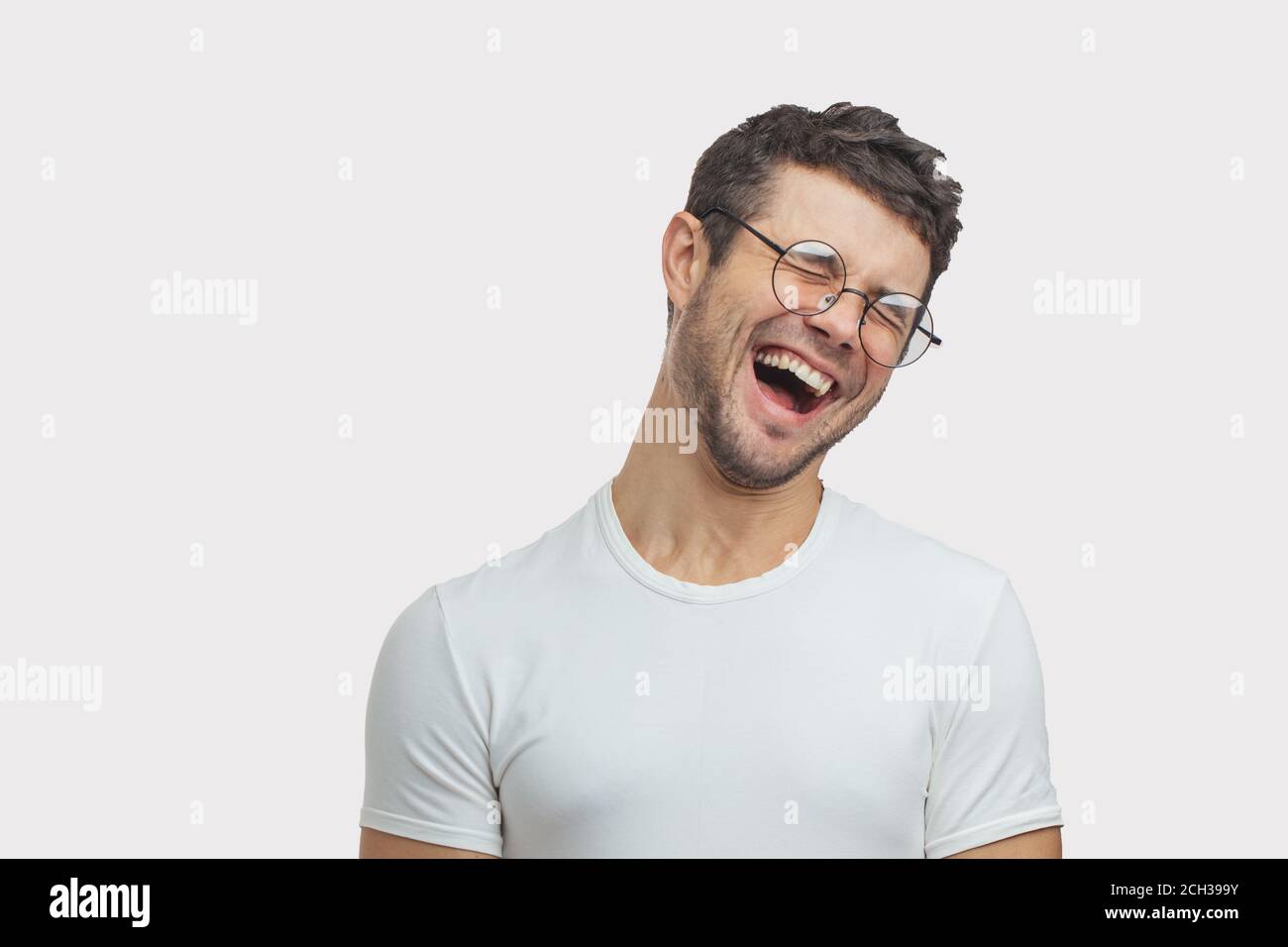 emotional man in glasses with hysterical laugh.isolated white ...