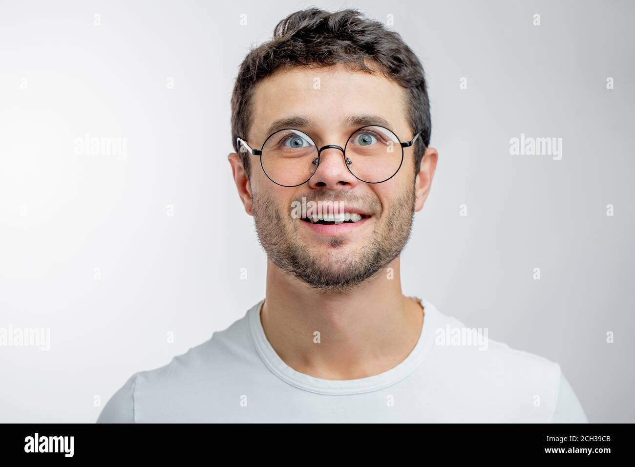 young emotional man is admiring with the beauty of young woman. guy is ...