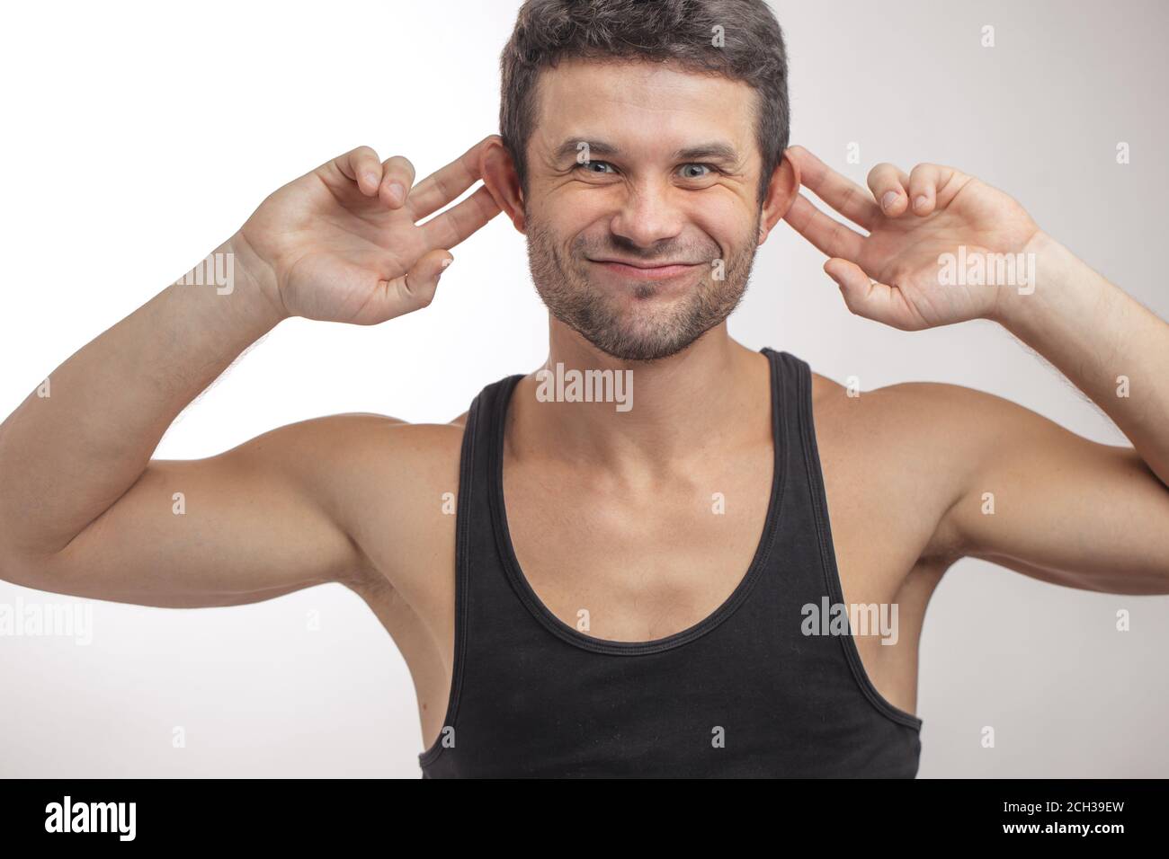 Photo of young mad guy showing his ears. ingnore someone. bad behavior ...