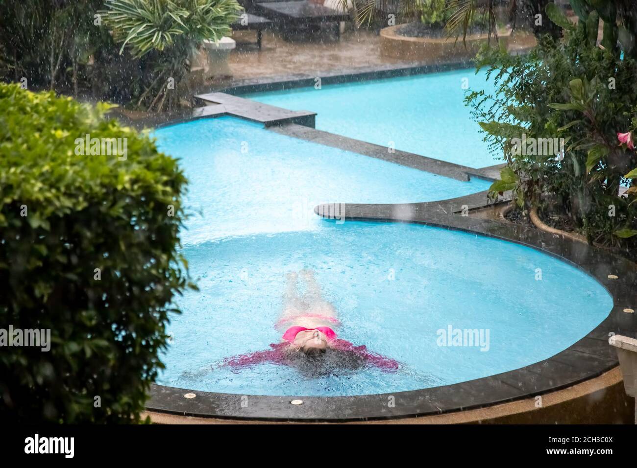 Bikini umbrella rain hi-res stock photography and images - Alamy
