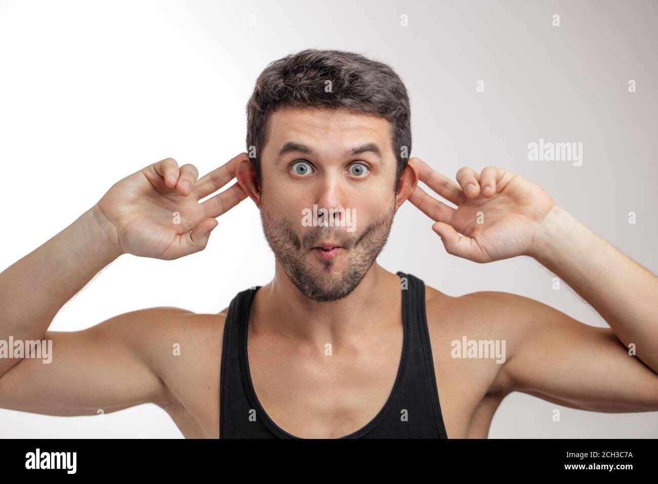 funny man looks like monkey. pretend chimpanzee. young man entertaining ...