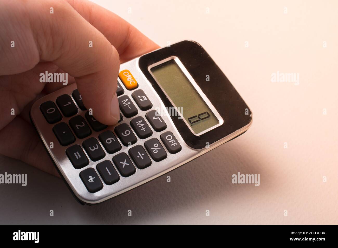 Electronic calculator device with keyboard and display in hand Stock ...