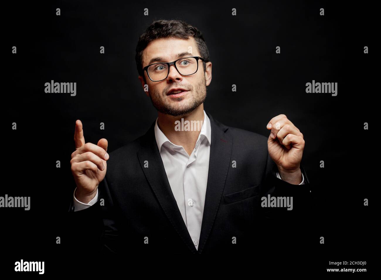 handsome guy pointing up is thinking about the idea. just a minute ...