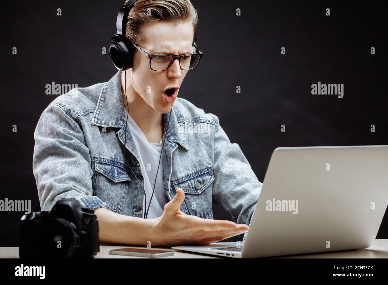 Caucasian man looking annoyed in front of the computer. scold the ...