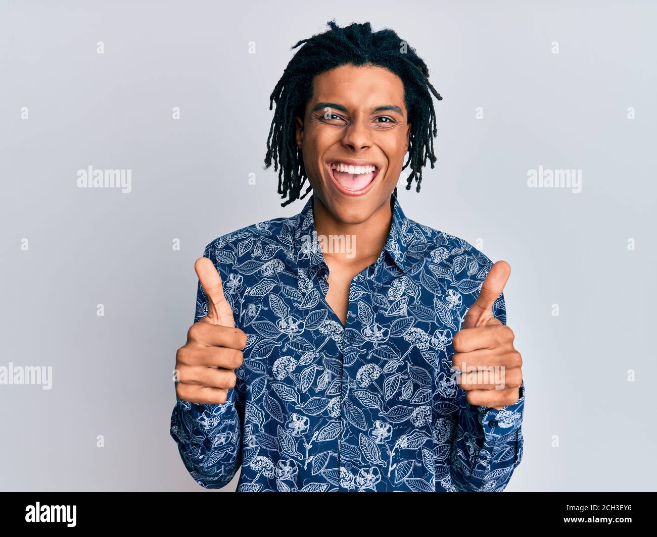 Young african american man wearing 80s style shirt success sign doing ...