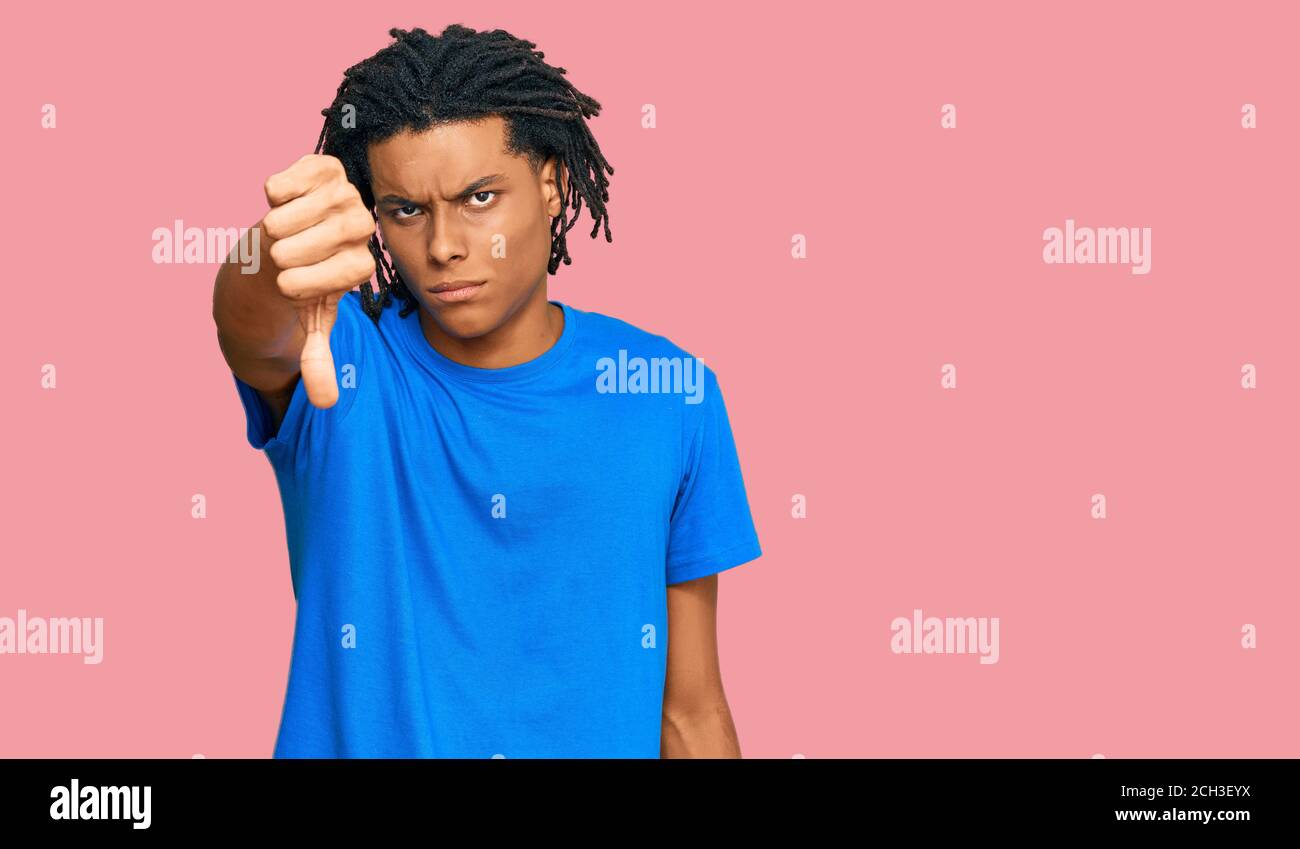 Young african american man wearing casual clothes looking unhappy and ...