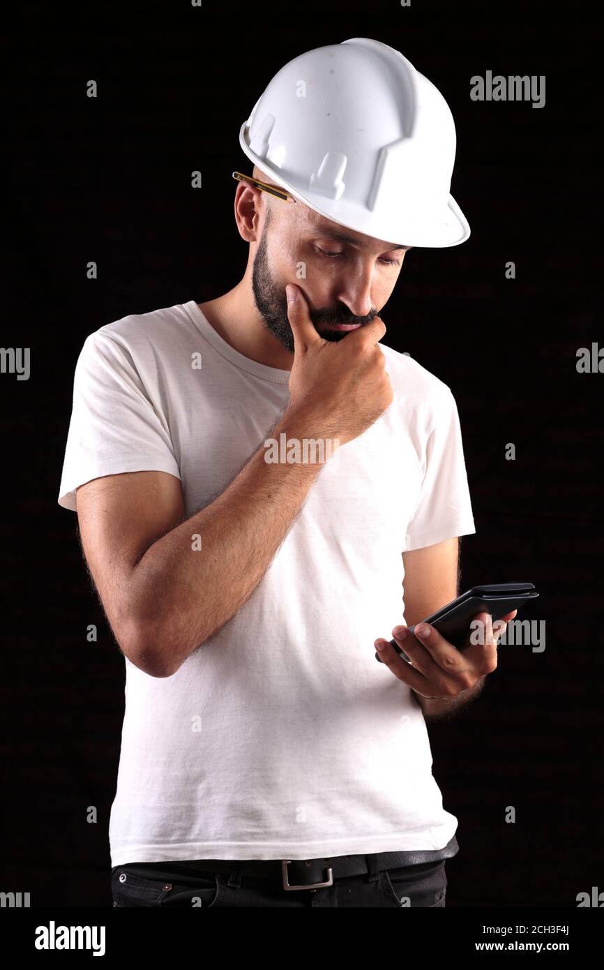 Construction worker thinking hi-res stock photography and images - Alamy