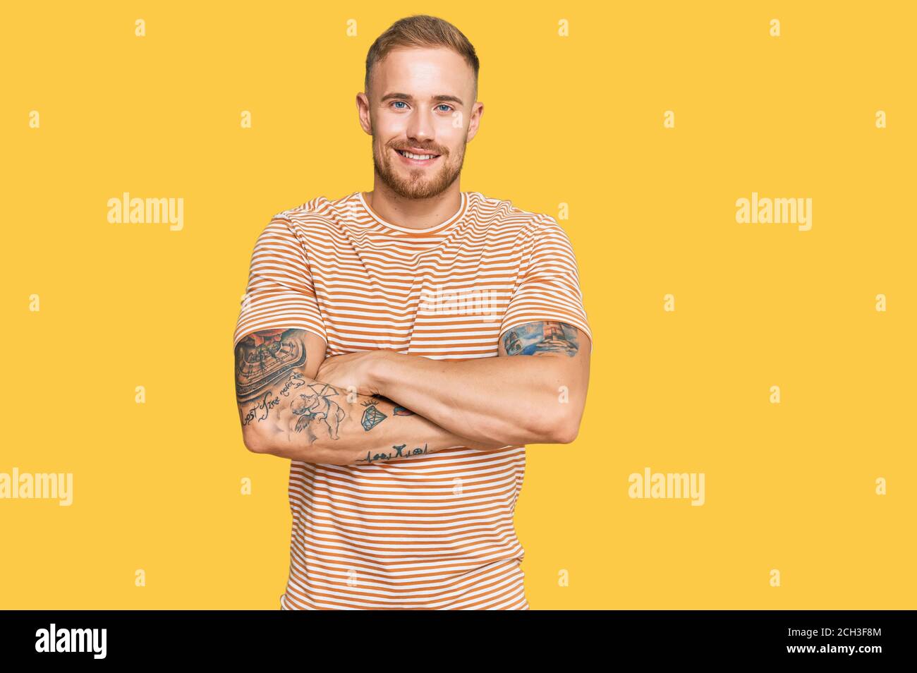 Young irish man wearing casual clothes happy face smiling with crossed ...