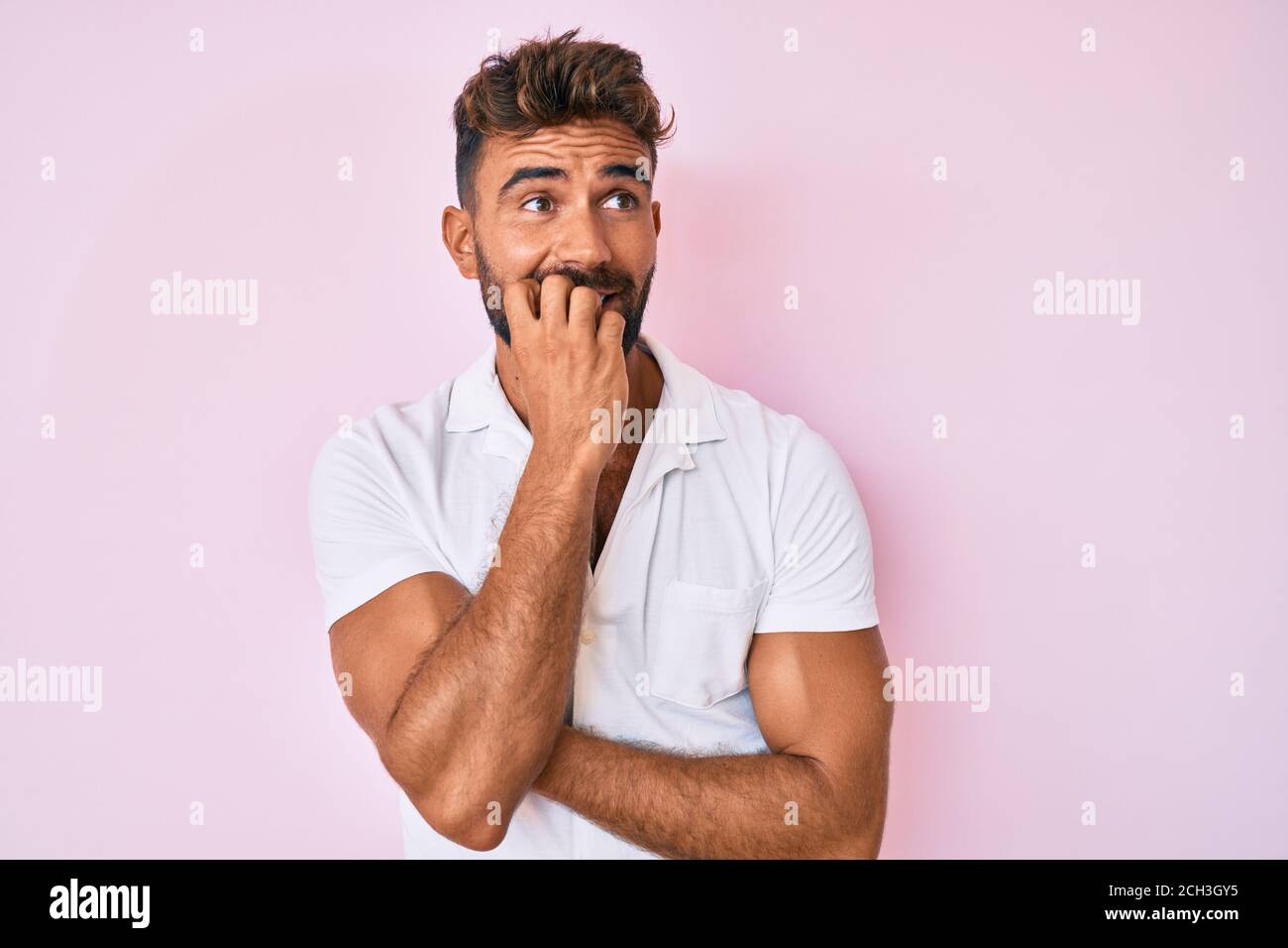 Young hispanic man wearing casual clothes looking stressed and nervous ...