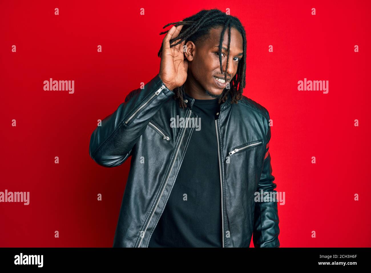African american man with braids wearing black leather jacket smiling ...