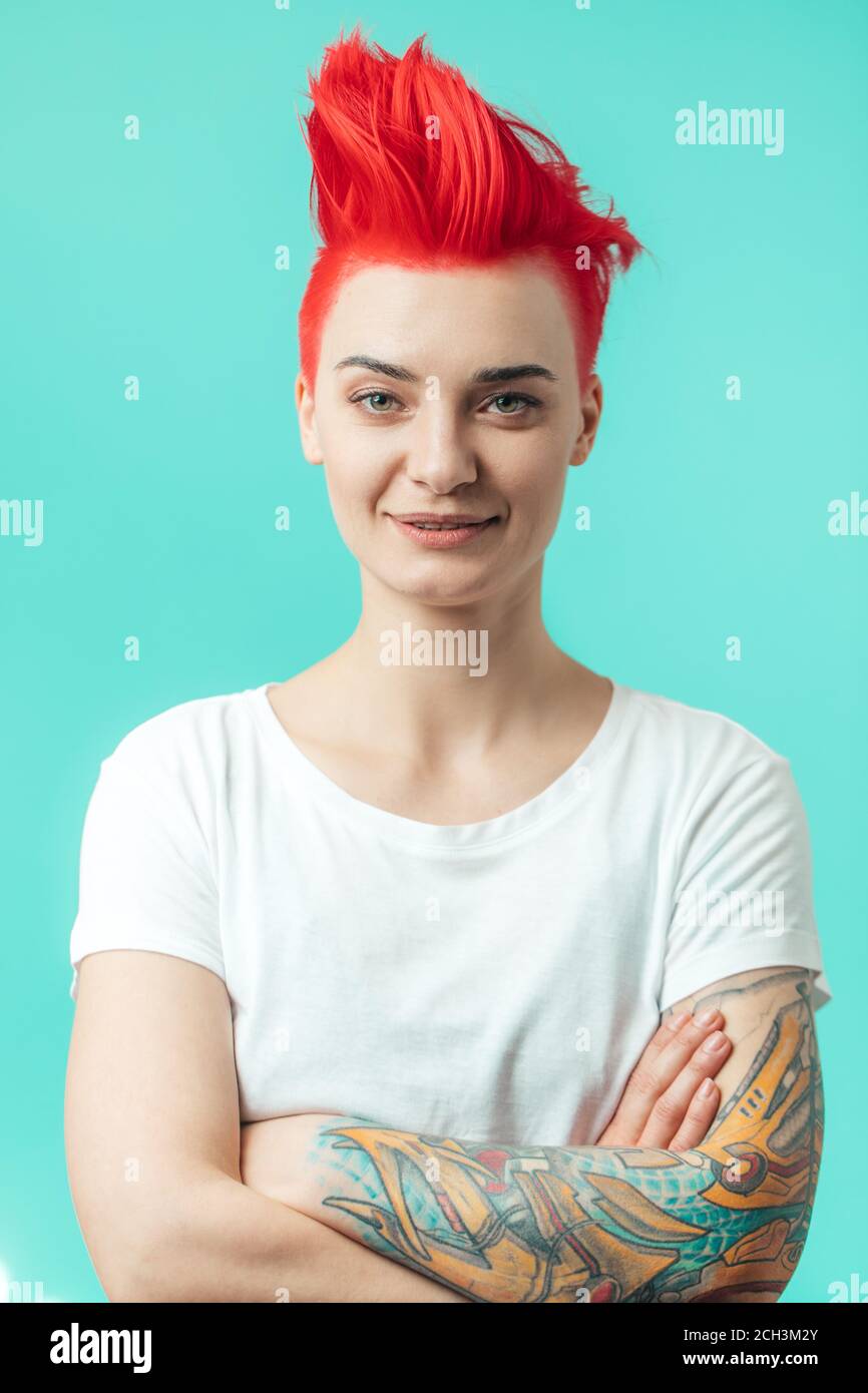 punk concept.stylish girl with tattoo on the arm with positive ...