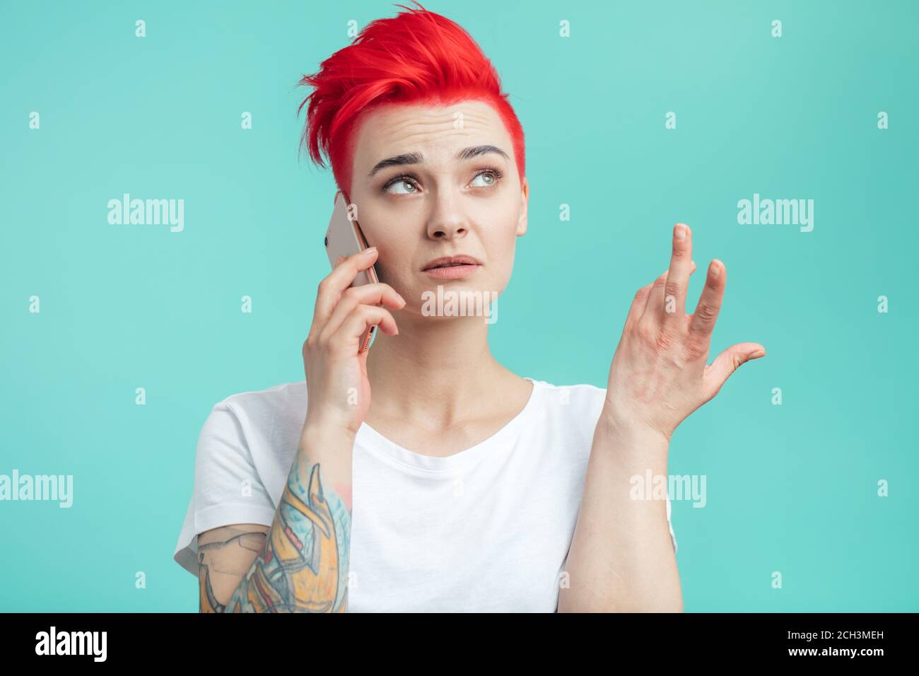 young attractive female using gestures during talking on the phone ...