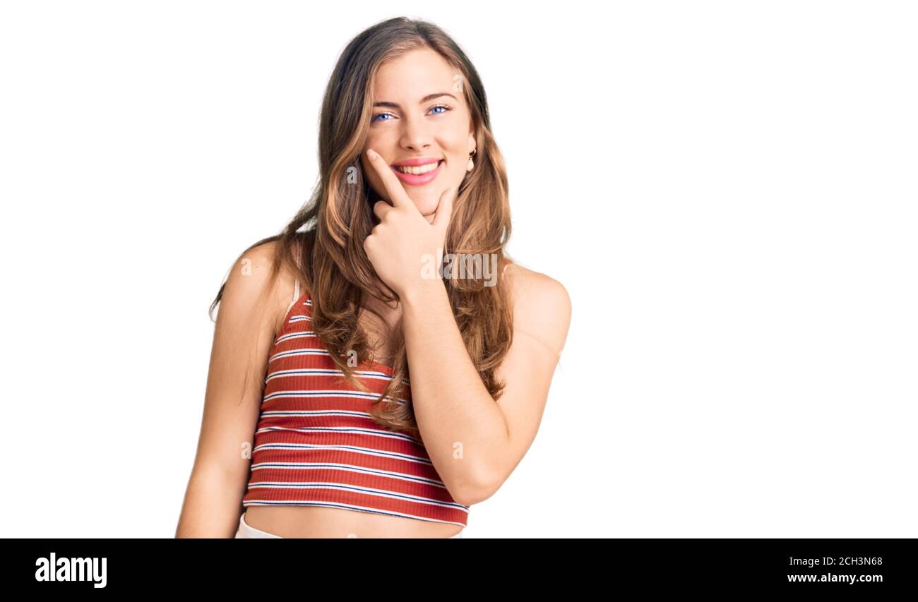 Beautiful caucasian young woman wearing casual clothes looking confident at the camera smiling ...