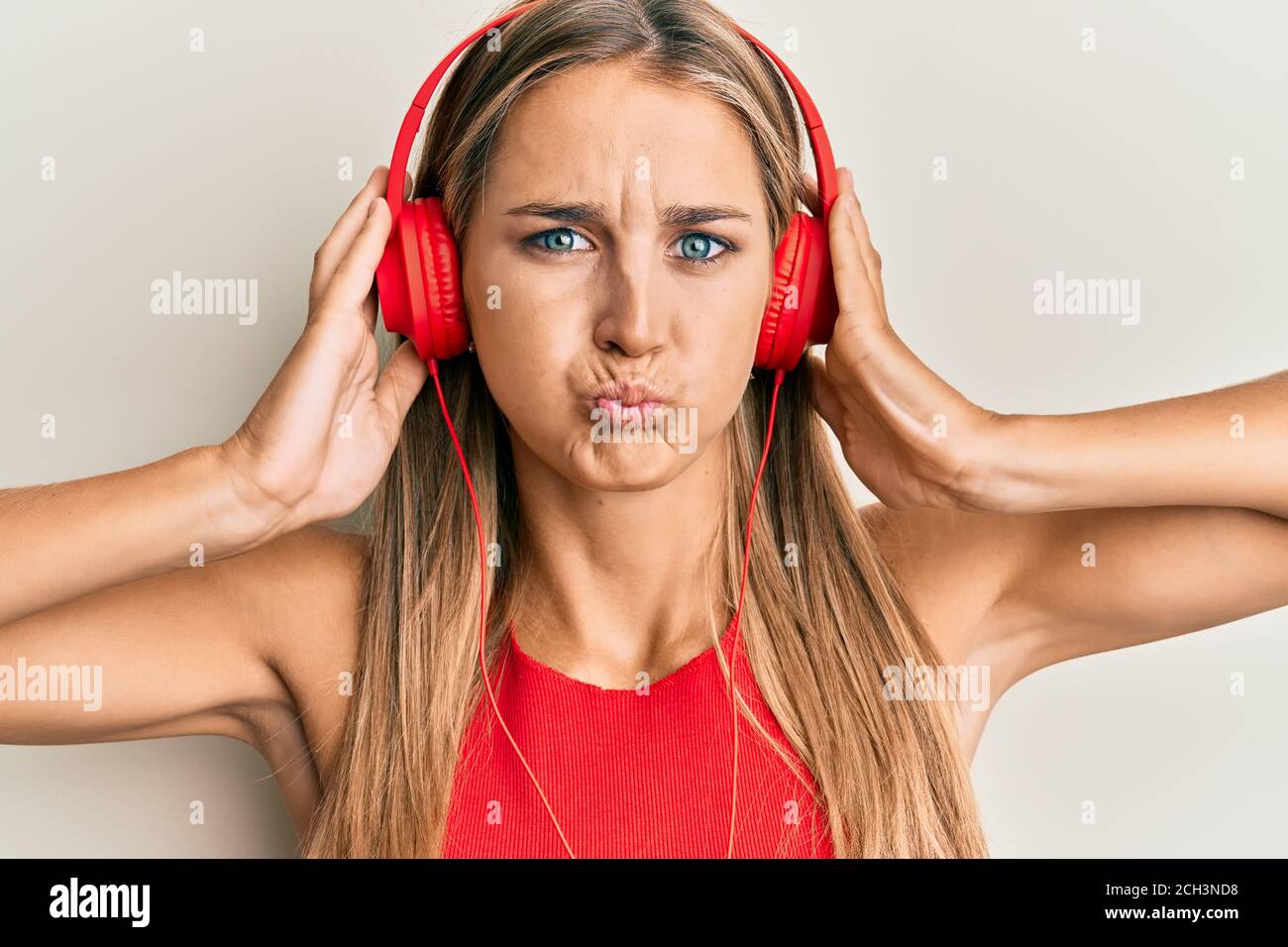 Blonde Girl Listening To Music
