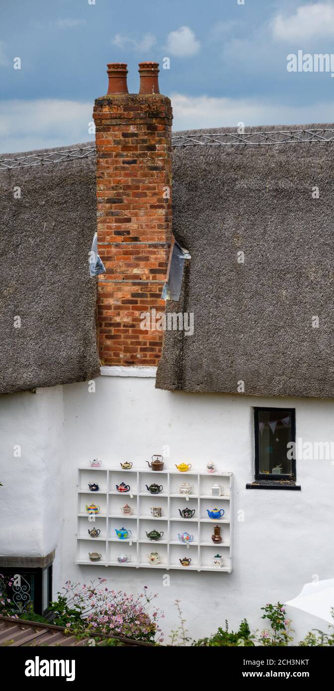 A collection of teapots oon the outside wall of a tea shop in Tiverton ...