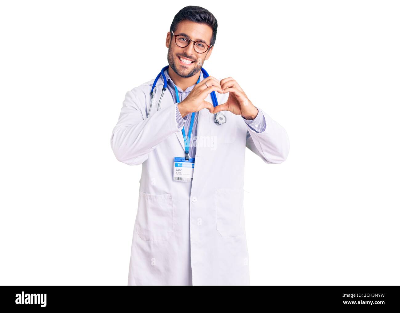 Young hispanic man wearing doctor uniform and stethoscope smiling in ...