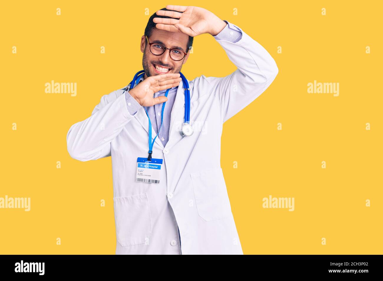 Young hispanic man wearing doctor uniform and stethoscope smiling ...