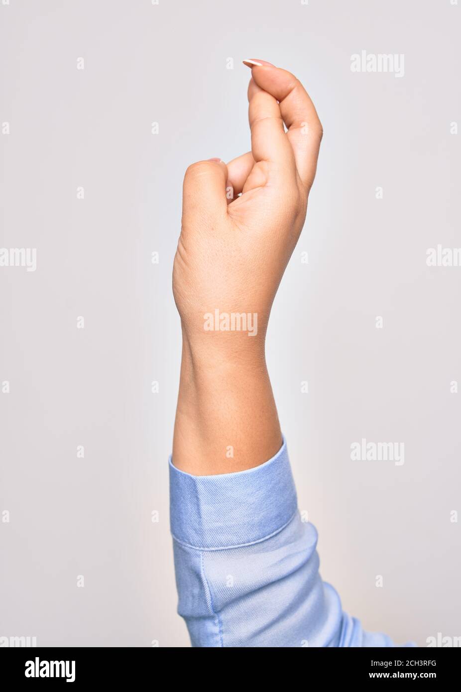Hand of caucasian young woman doing lucky sign with crossed fingers ...