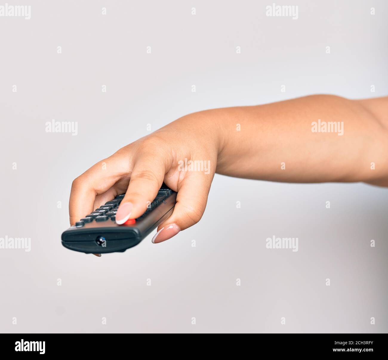 Hand of caucasian young woman changing television channel holding tv ...