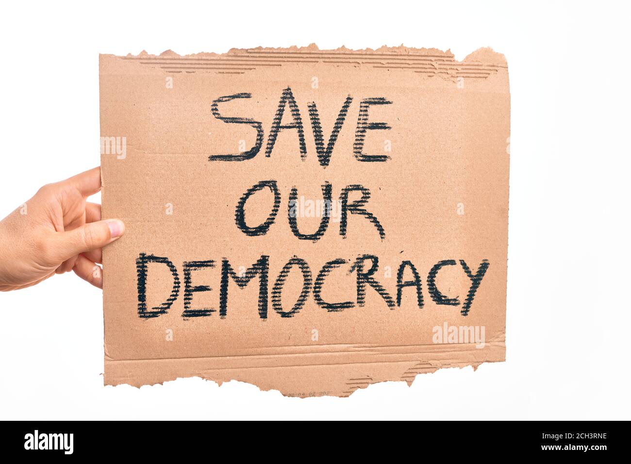 Cardboard banner with SAVE OUT DEMOCRACY text asking for political ...
