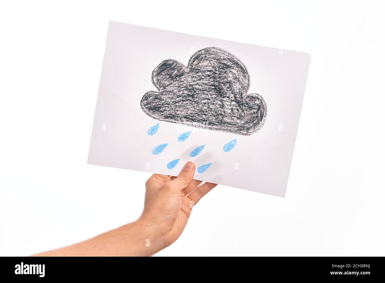 Holding paper sheet with a drawing of a dark cloud with drops, raining ...