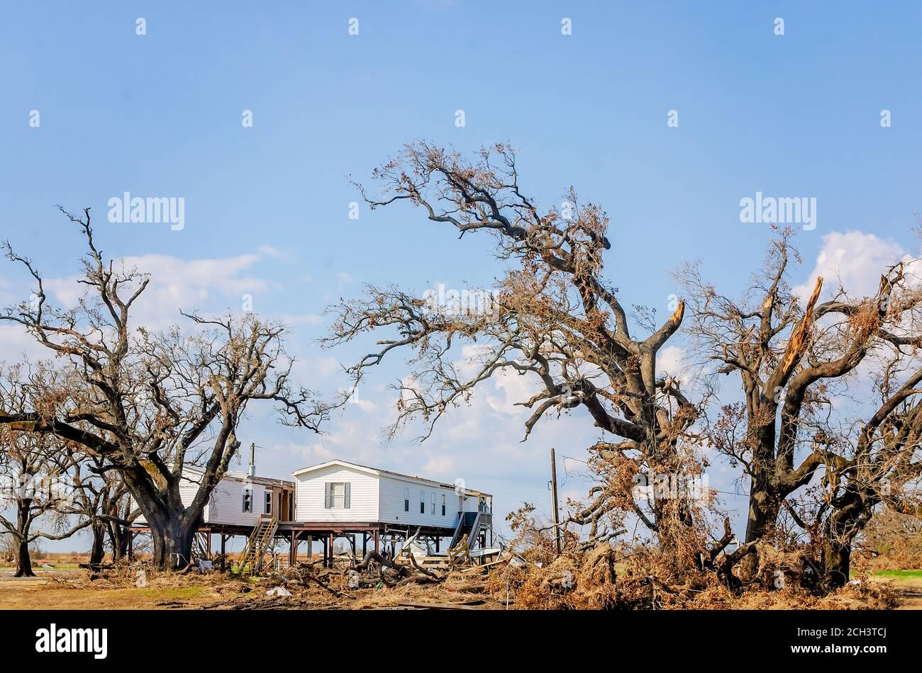 Debris from Hurricane Laura surrounds a home, Sept. 11, 2020, in ...