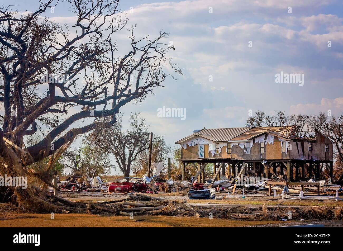 Debris surrounds a damaged home after Hurricane Laura, Sept. 11, 2020 ...