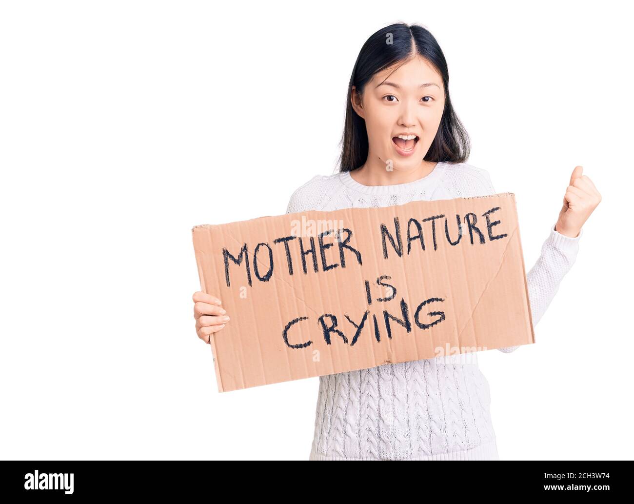 Young beautiful chinese woman holding mother nature is crying cardboard ...