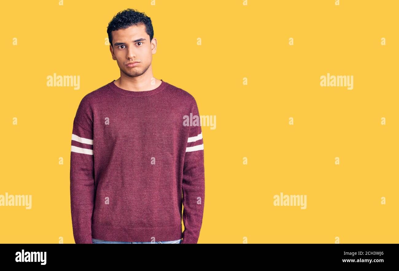 Hispanic handsome young man wearing casual clothes depressed and worry ...