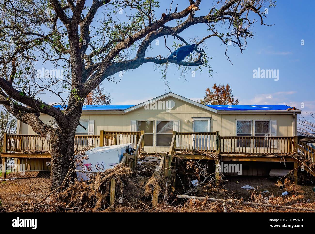 Debris surrounds a damaged home after Hurricane Laura, Sept. 11, 2020 ...