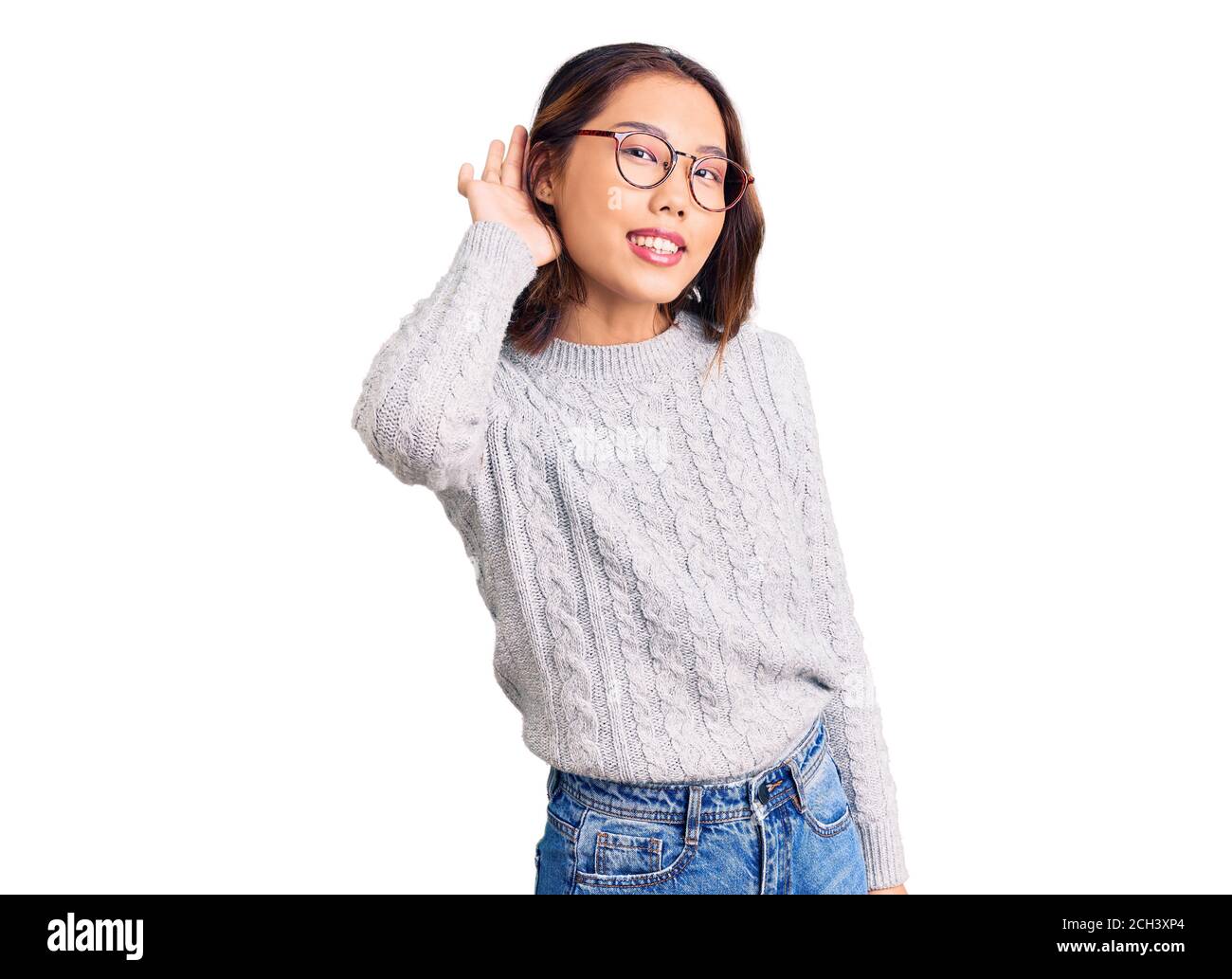 Young beautiful chinese girl wearing casual clothes smiling with hand ...