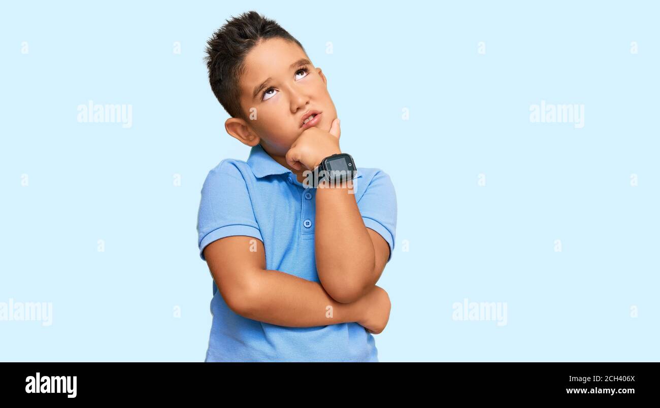Little boy hispanic kid wearing casual clothes thinking worried about a ...