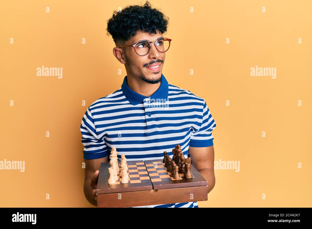 Nerd with chess game hi-res stock photography and images - Alamy