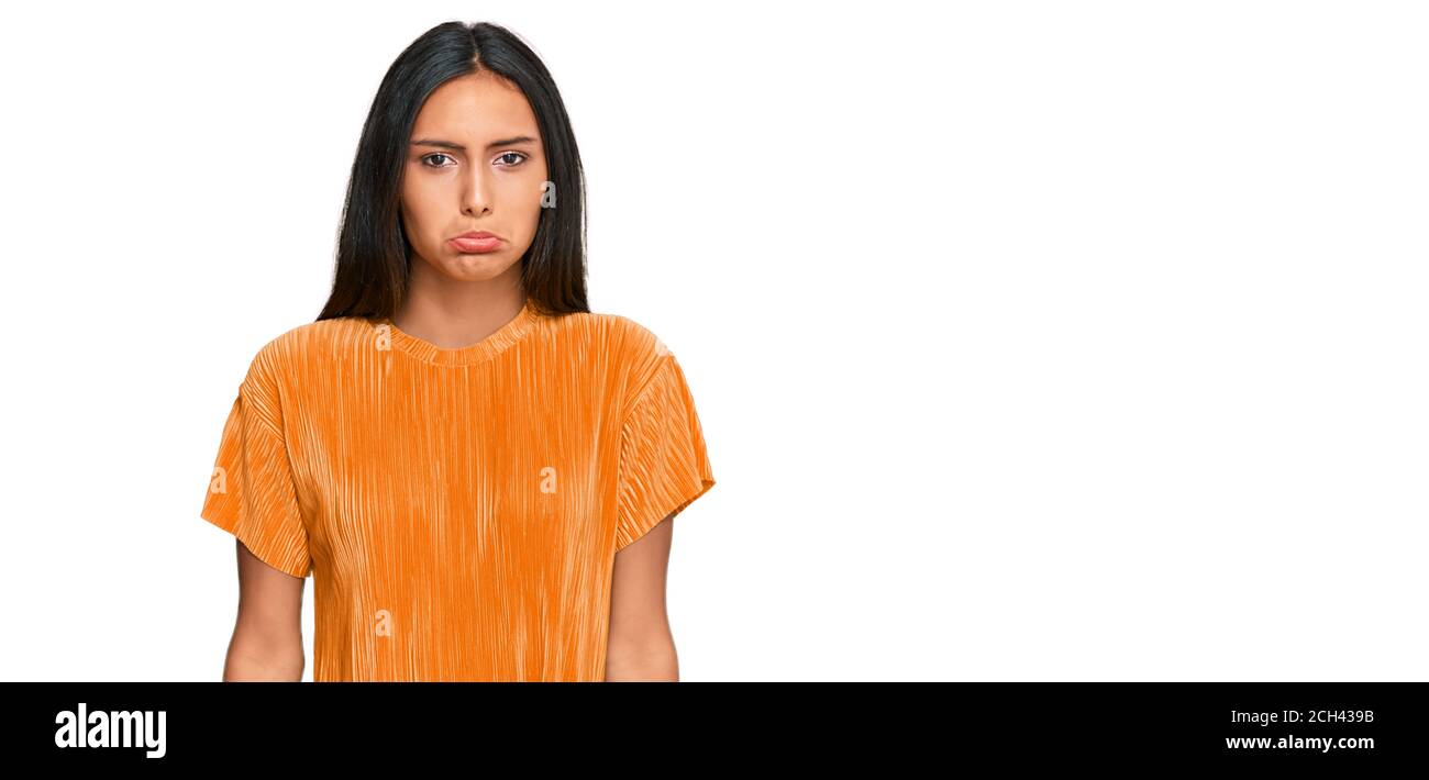 Young Brunette Arab Woman Wearing Casual Clothes Depressed And Worry