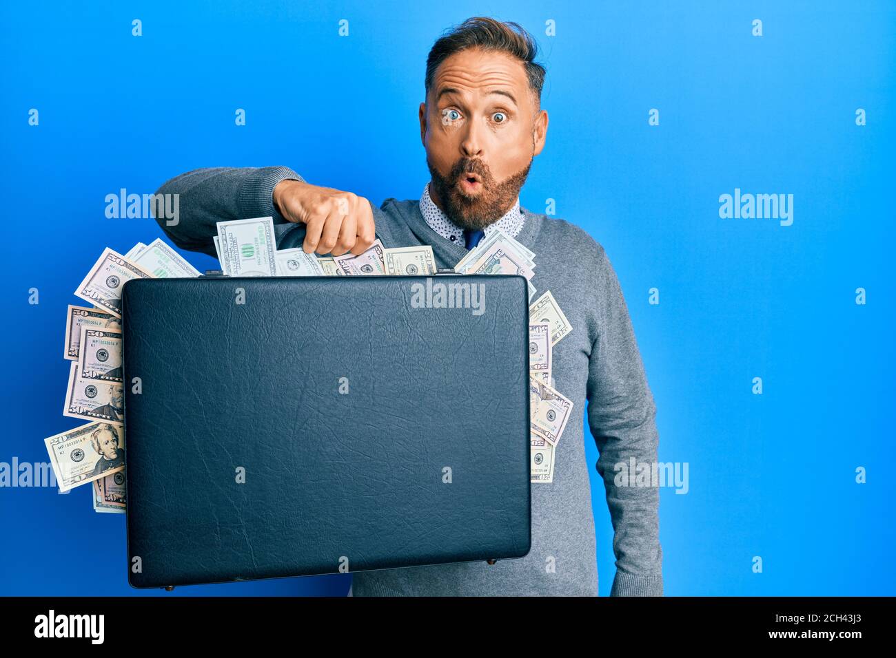 Man holding open briefcase full hi-res stock photography and images - Alamy