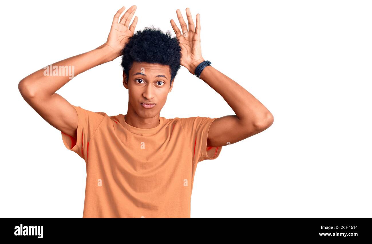 Young african american man wearing casual clothes doing bunny ears ...
