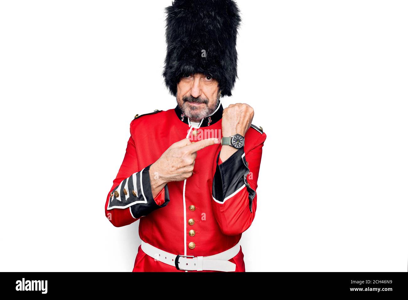 Middle age handsome wales guard man wearing traditional uniform over ...