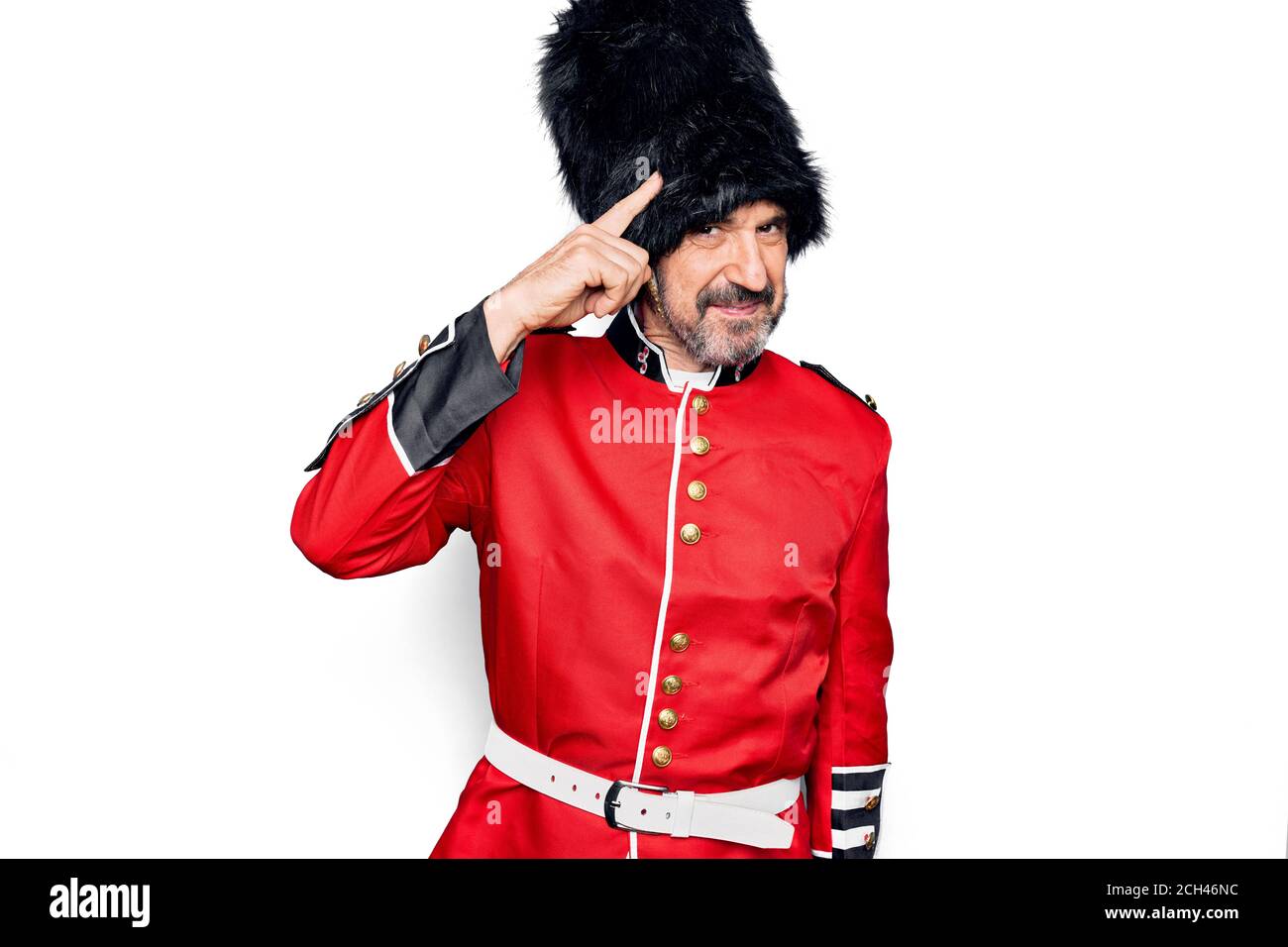 Middle age handsome wales guard man wearing traditional uniform over ...