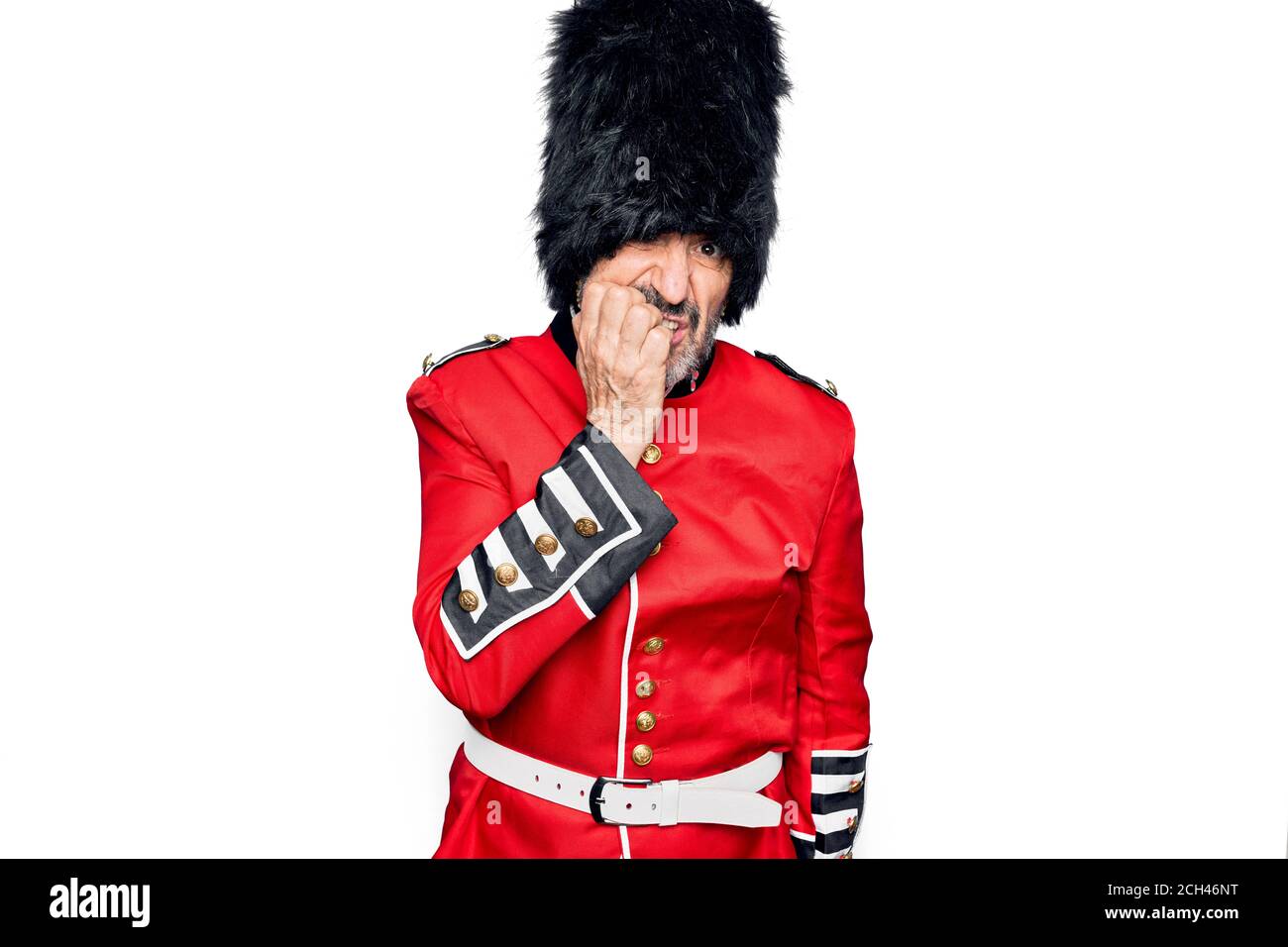 Middle age handsome wales guard man wearing traditional uniform over ...