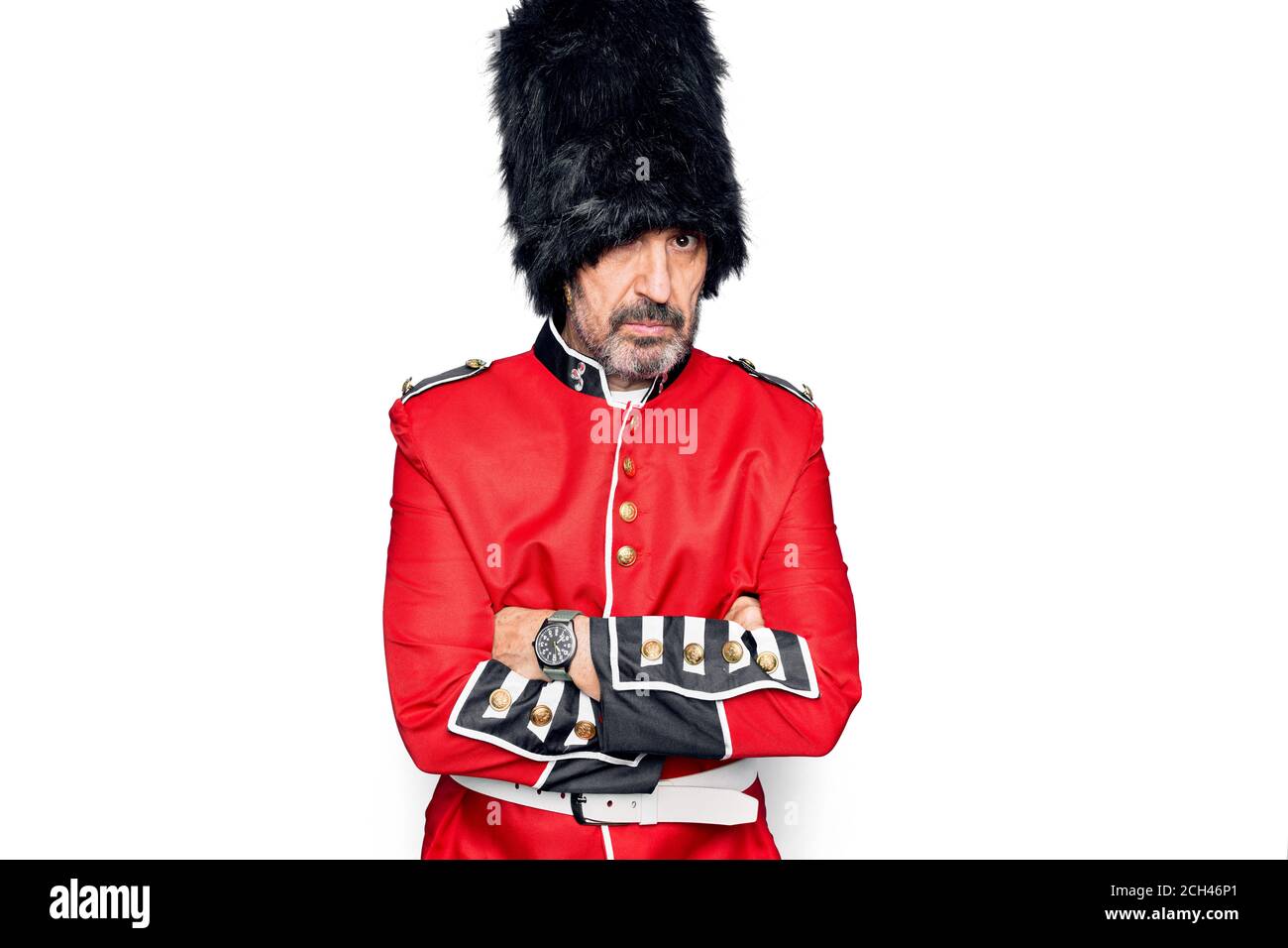 Middle age handsome wales guard man wearing traditional uniform over ...