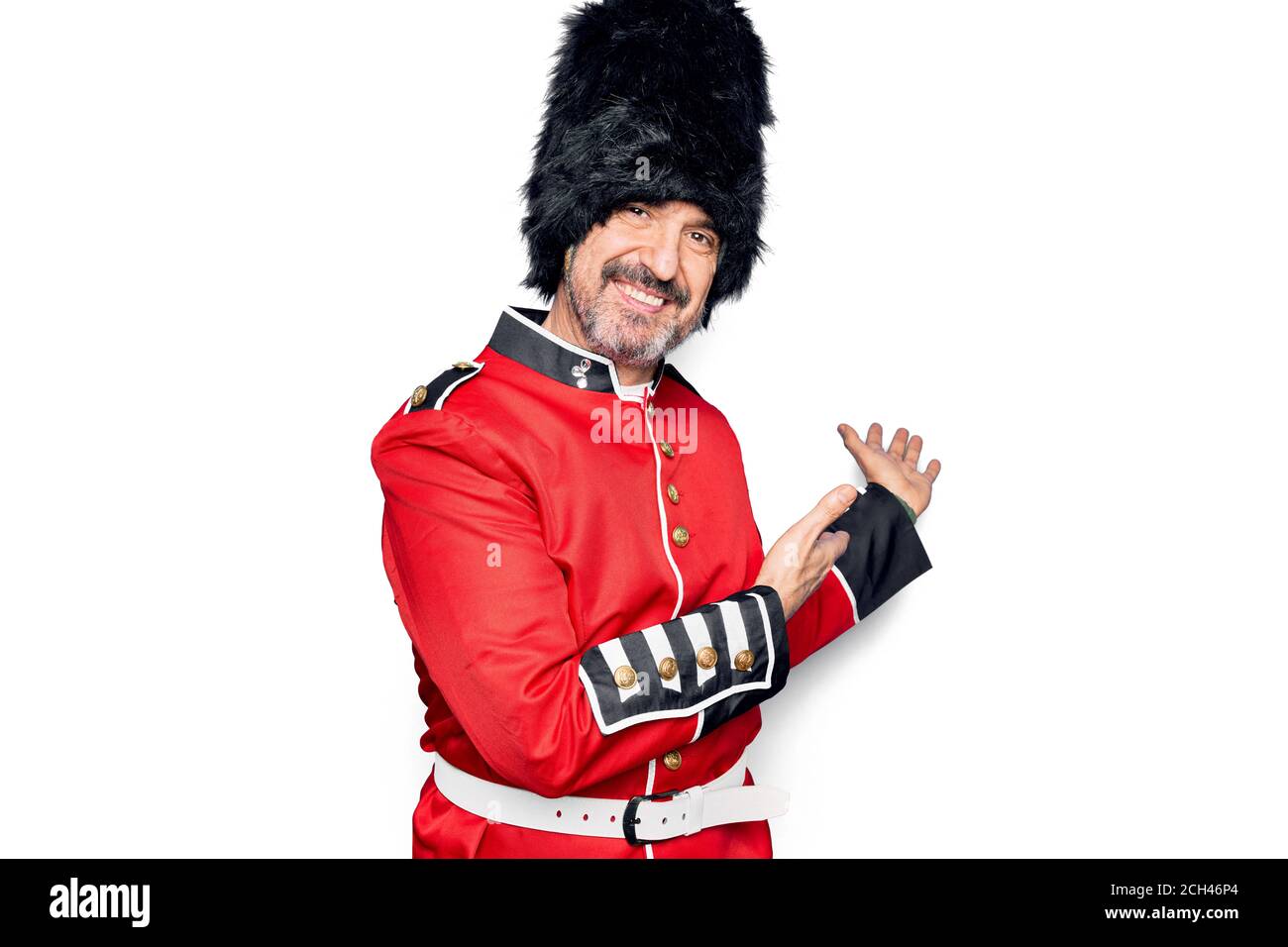 Middle age handsome wales guard man wearing traditional uniform over ...