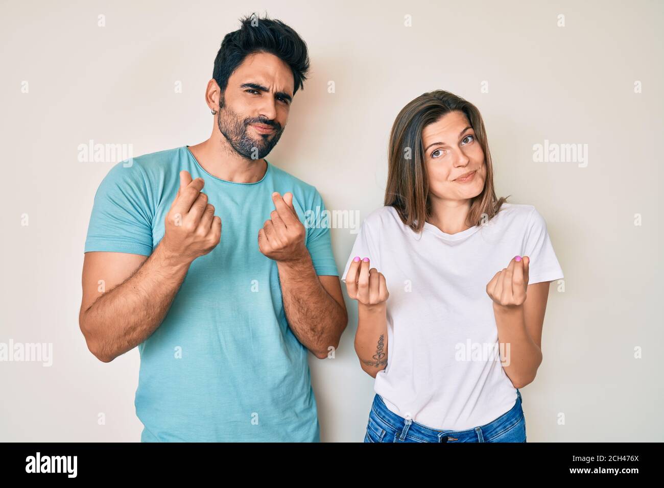 Beautiful young couple of boyfriend and girlfriend together doing money ...