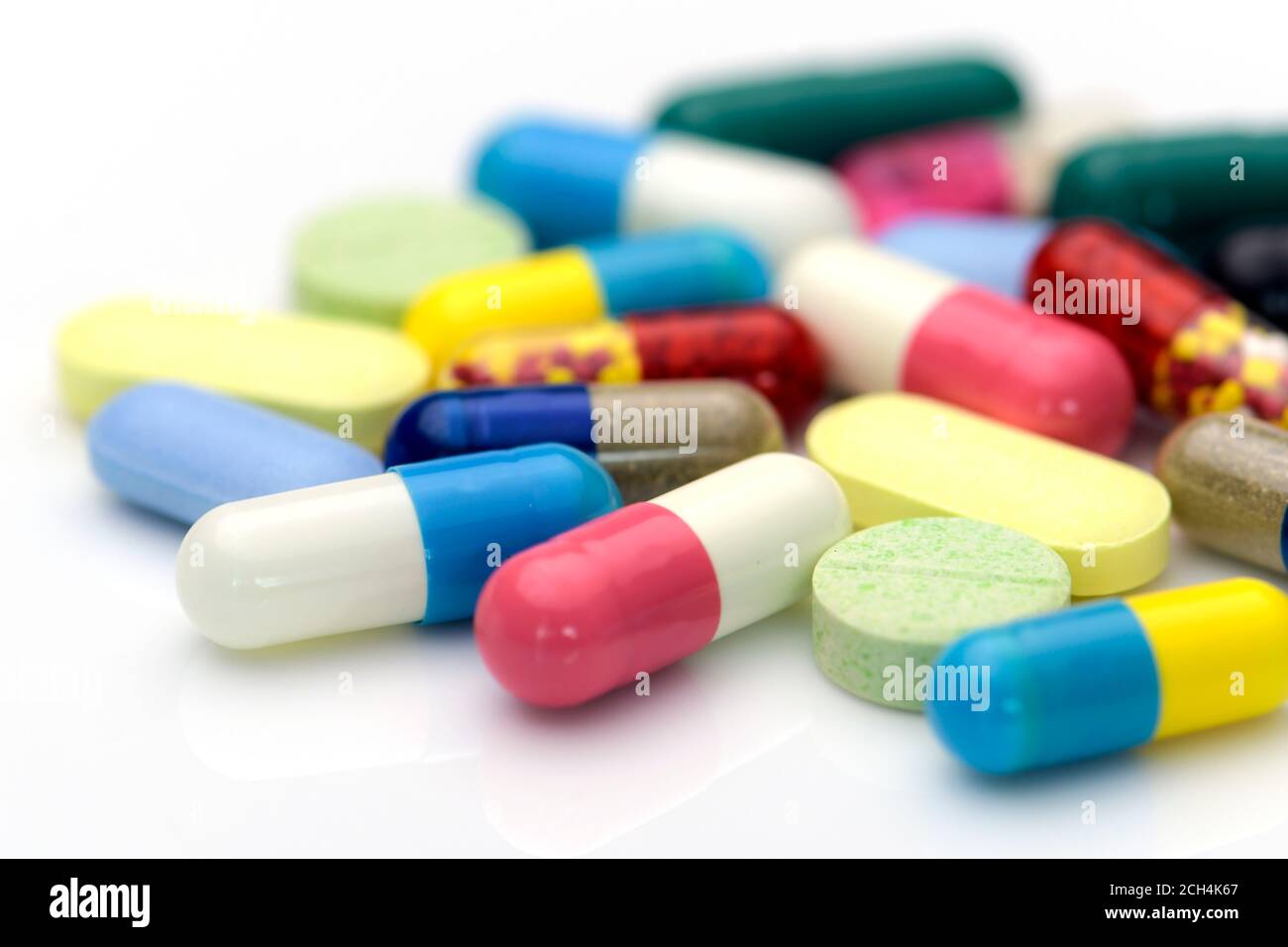 Oral medication background with warm light.Colorful of oral medications ...