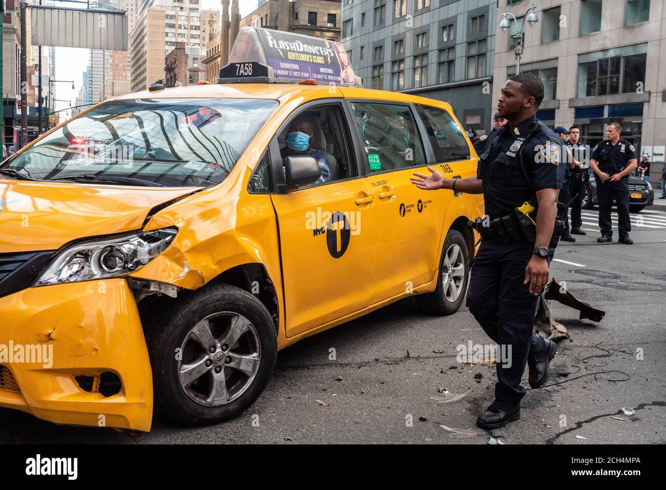 An NYPD cruiser and a yellow cab collide on Broadway and 58th Street in ...