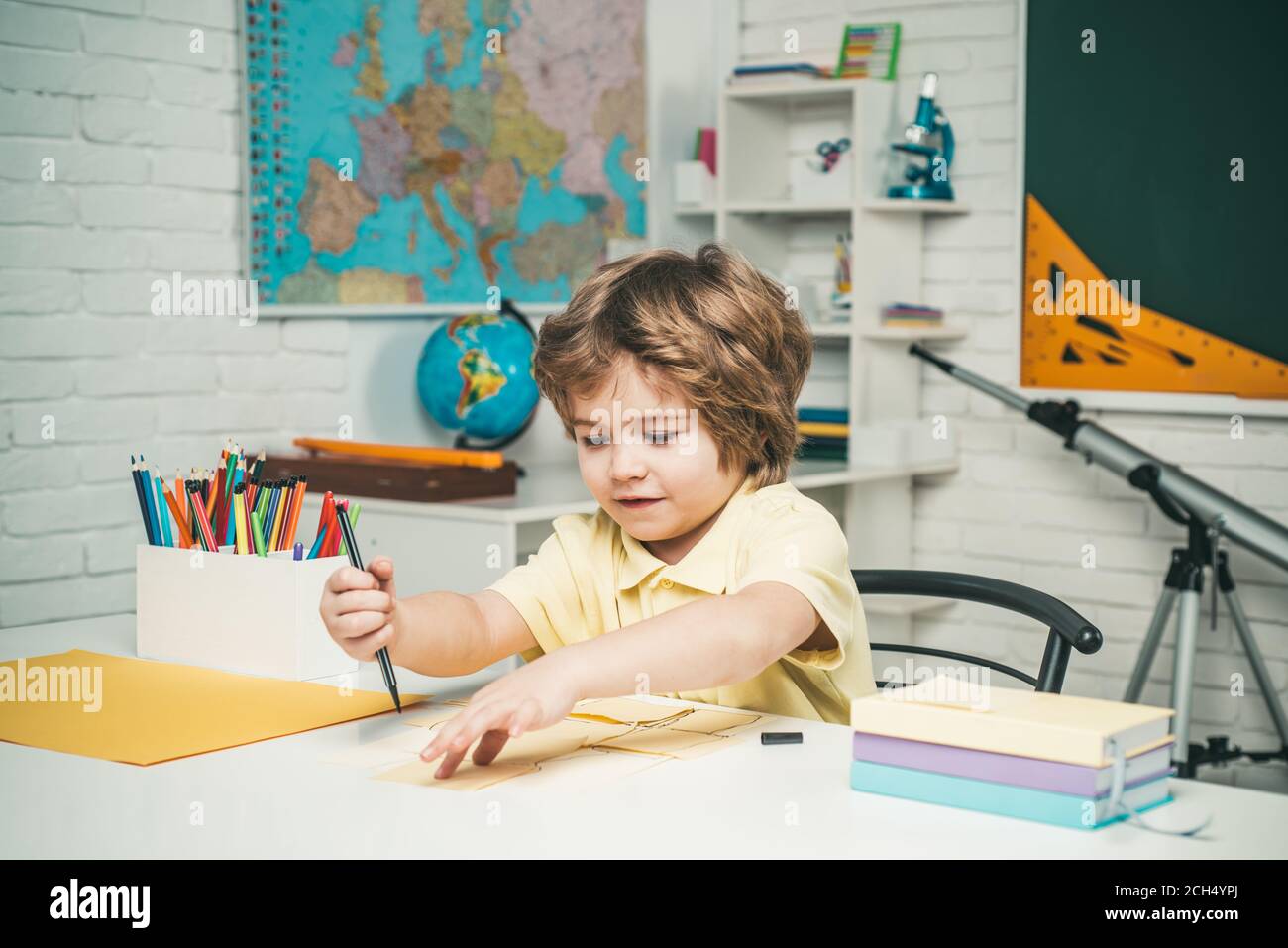 After school teaching. Kid gets ready for school. Schoolkid or ...