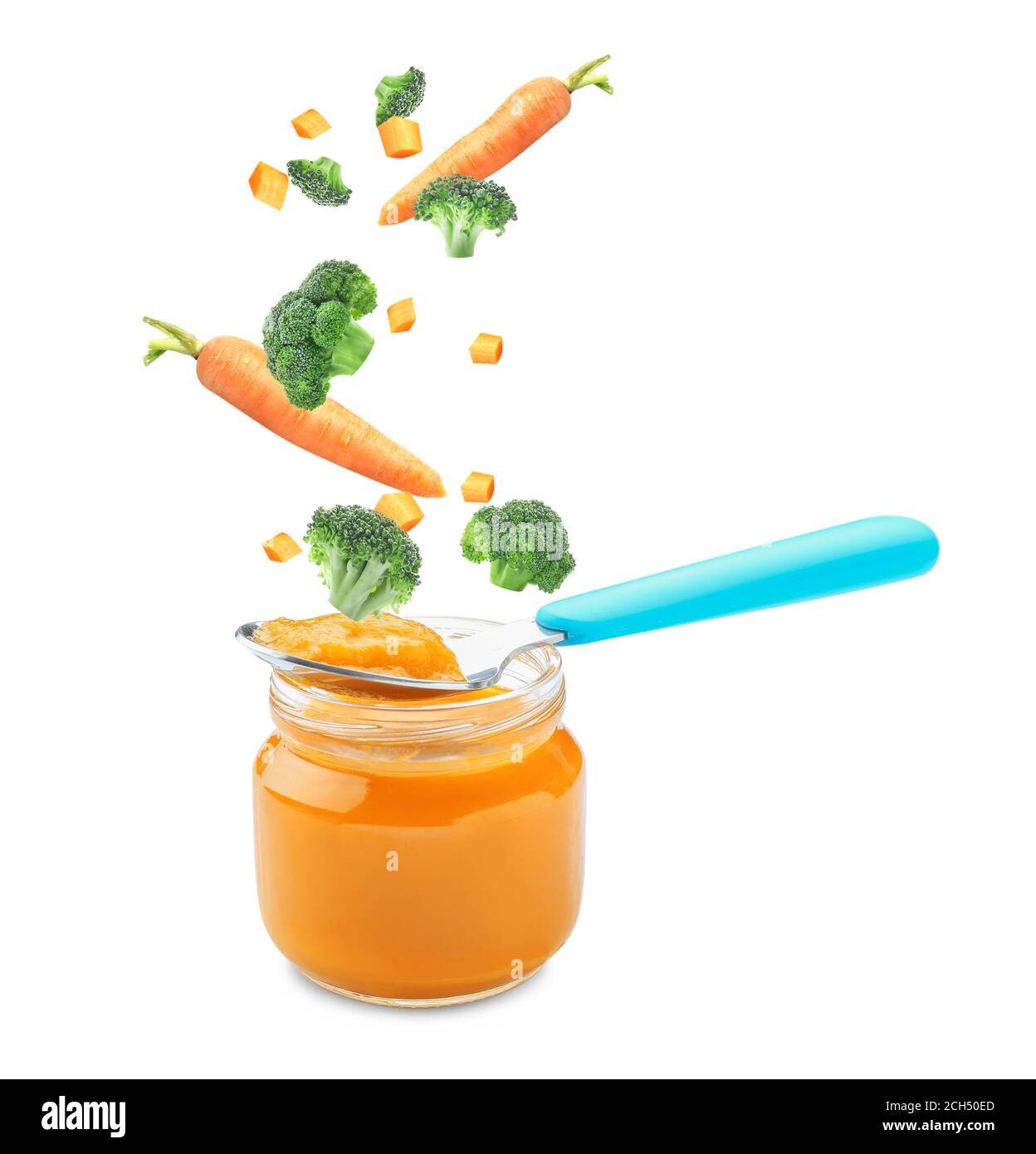 Jar with healthy baby food and falling ingredients on white background ...